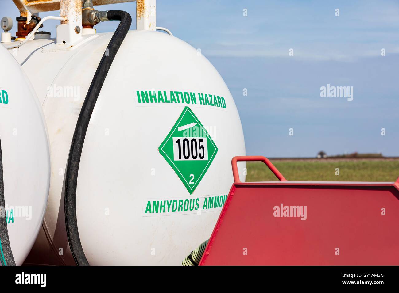 Anhydrous ammonia tank in farm field. Agriculture fertilizer ...
