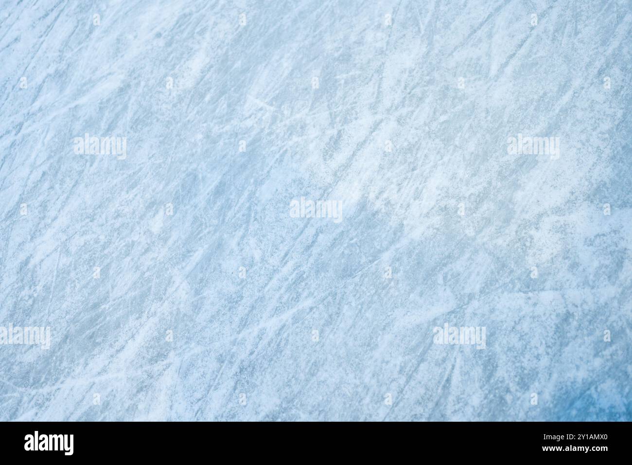 Icy background on rink with visible traces of skating, showcasing the ...