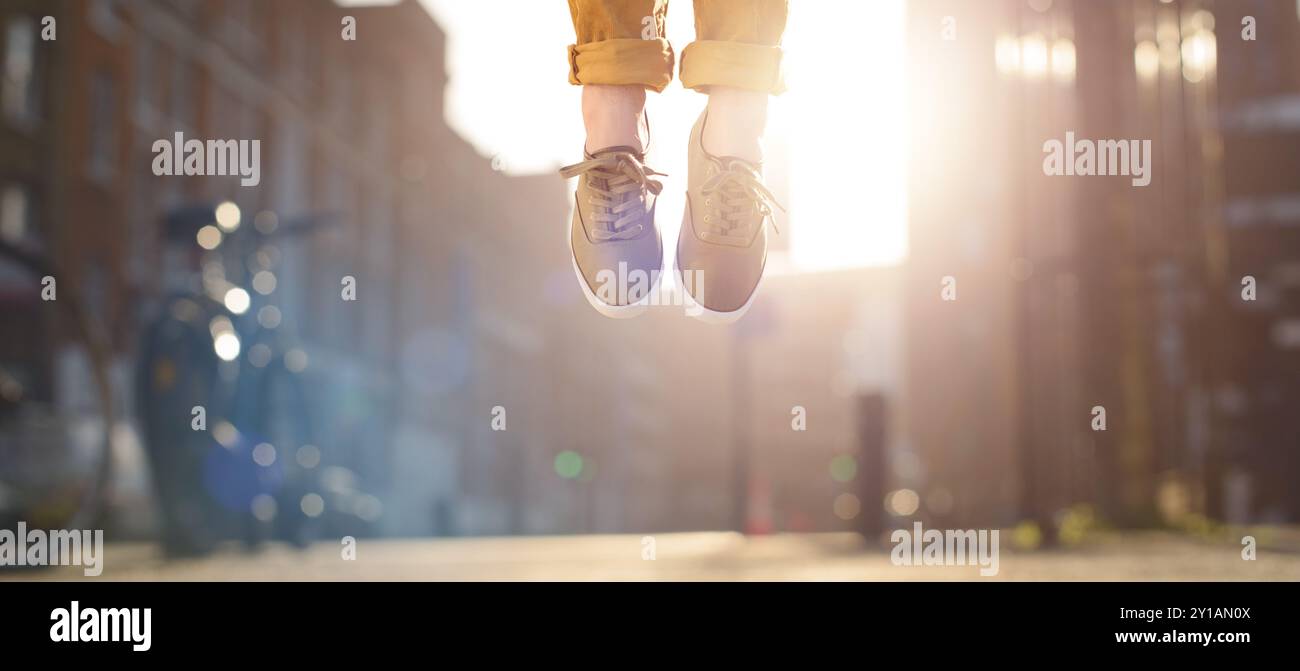 Legs of child, shoes and floating in air outside for celebration ...