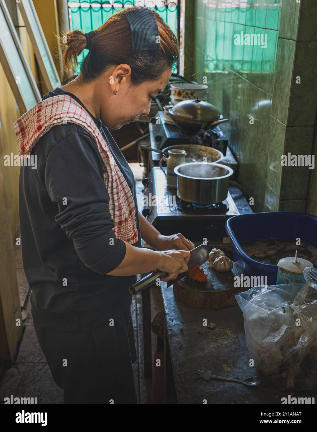 Balikpapan, Indonesia - August 4th, 2024. Cooking is a daily chore in ...