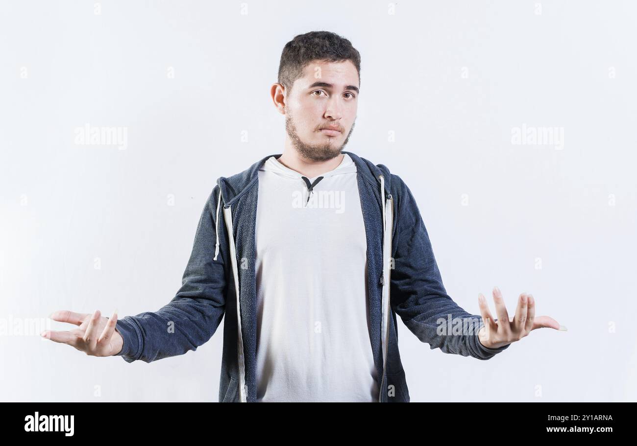 Puzzled person spreading hands isolated. Clueless young man with open ...