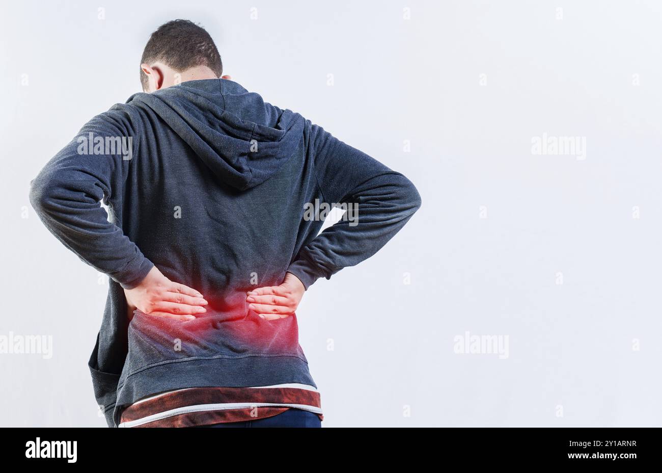 Back view of person with back ache isolated. Lumbar problems concept ...