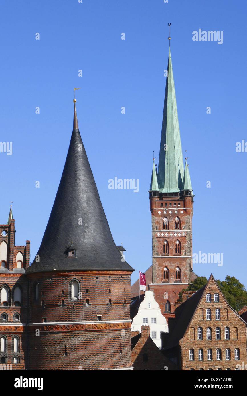 Holsten Gate with St Peter's Church and salt store in Luebeck Stock ...