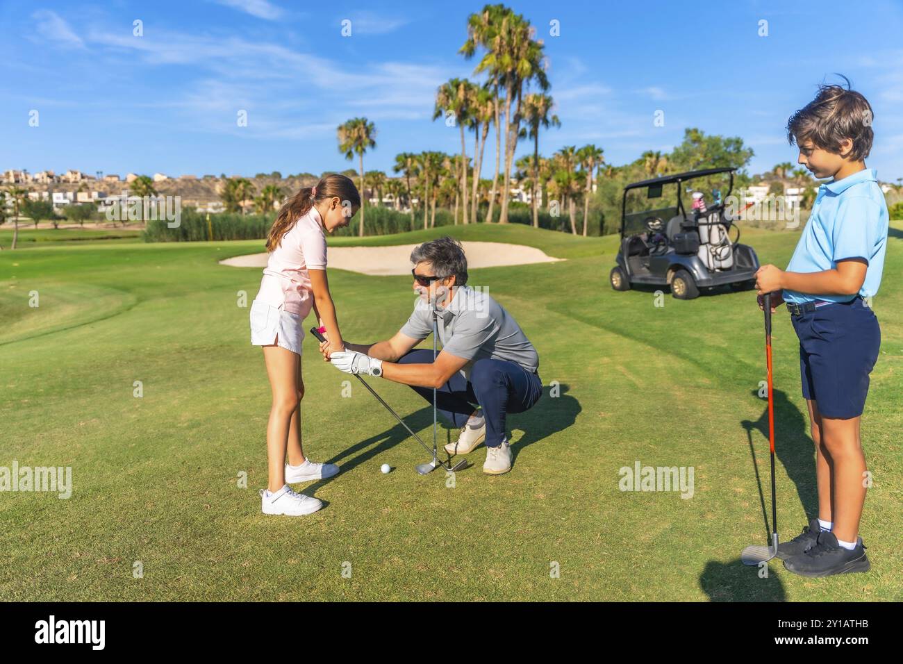 Child coach golf hi-res stock photography and images - Alamy