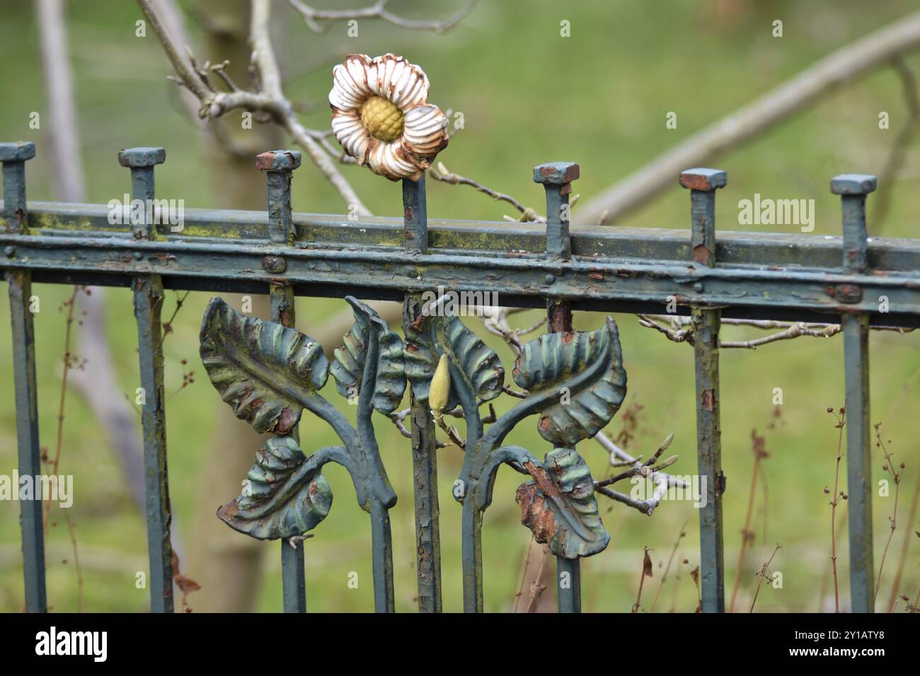 Wrought iron daisy on a garden fence Stock Photo - Alamy