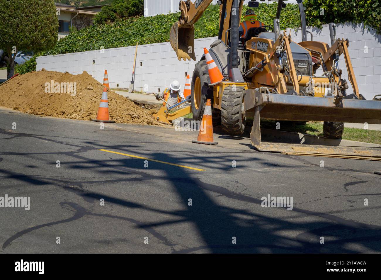 Road works digging construction in residential streets California, USA ...