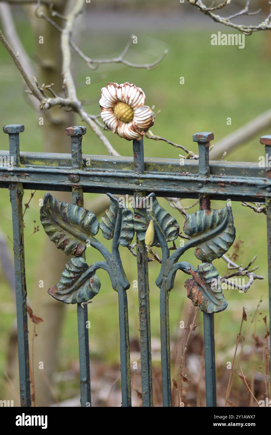 Wrought iron daisy on a garden fence Stock Photo - Alamy