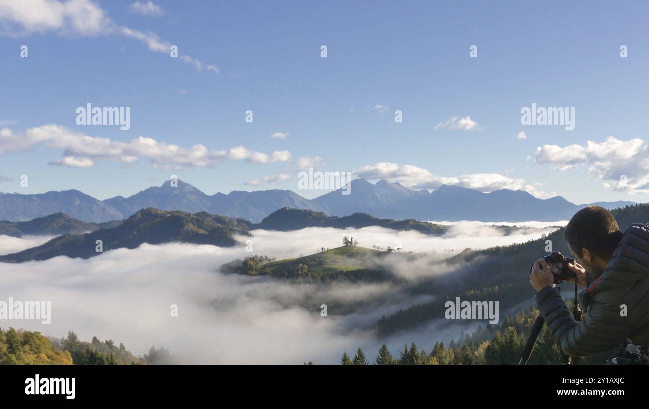 Man on wheelchair using mirrorless camera near the lake in nature Stock ...