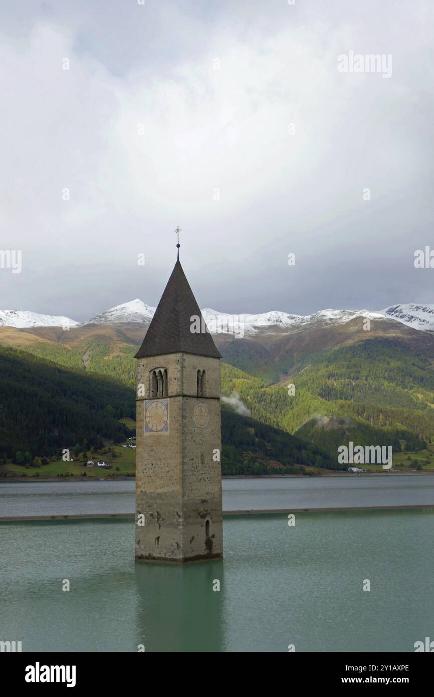 Bell tower of the former parish church of St Catherine in Lake Reschen ...