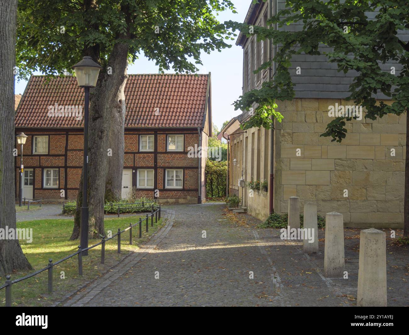 Historic neighbourhood with cobbled pavement and traditional brick ...