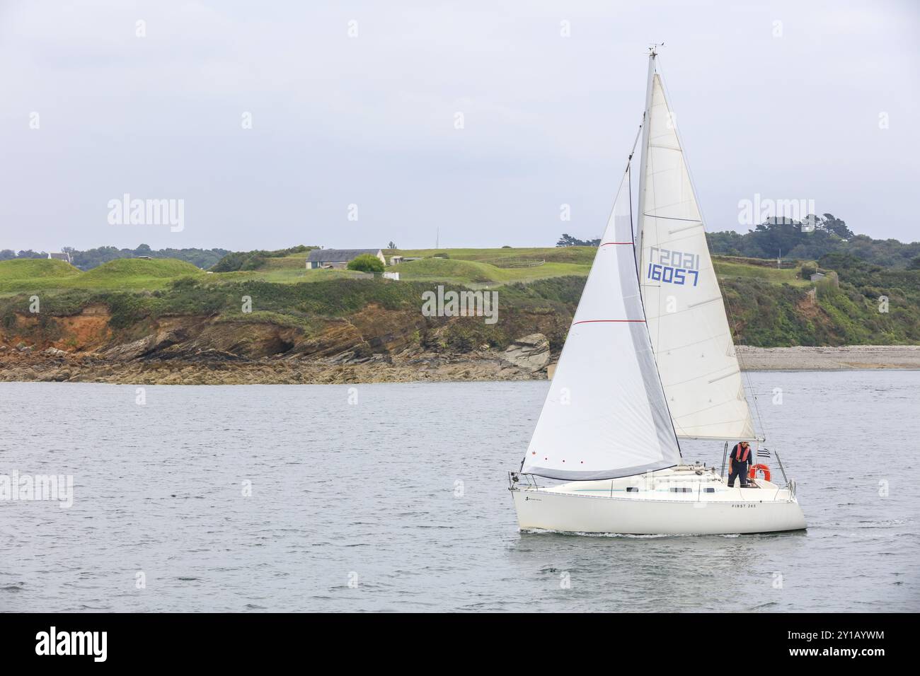 Sailing boat in front of the Pointe d'Armorique with former fort in the ...