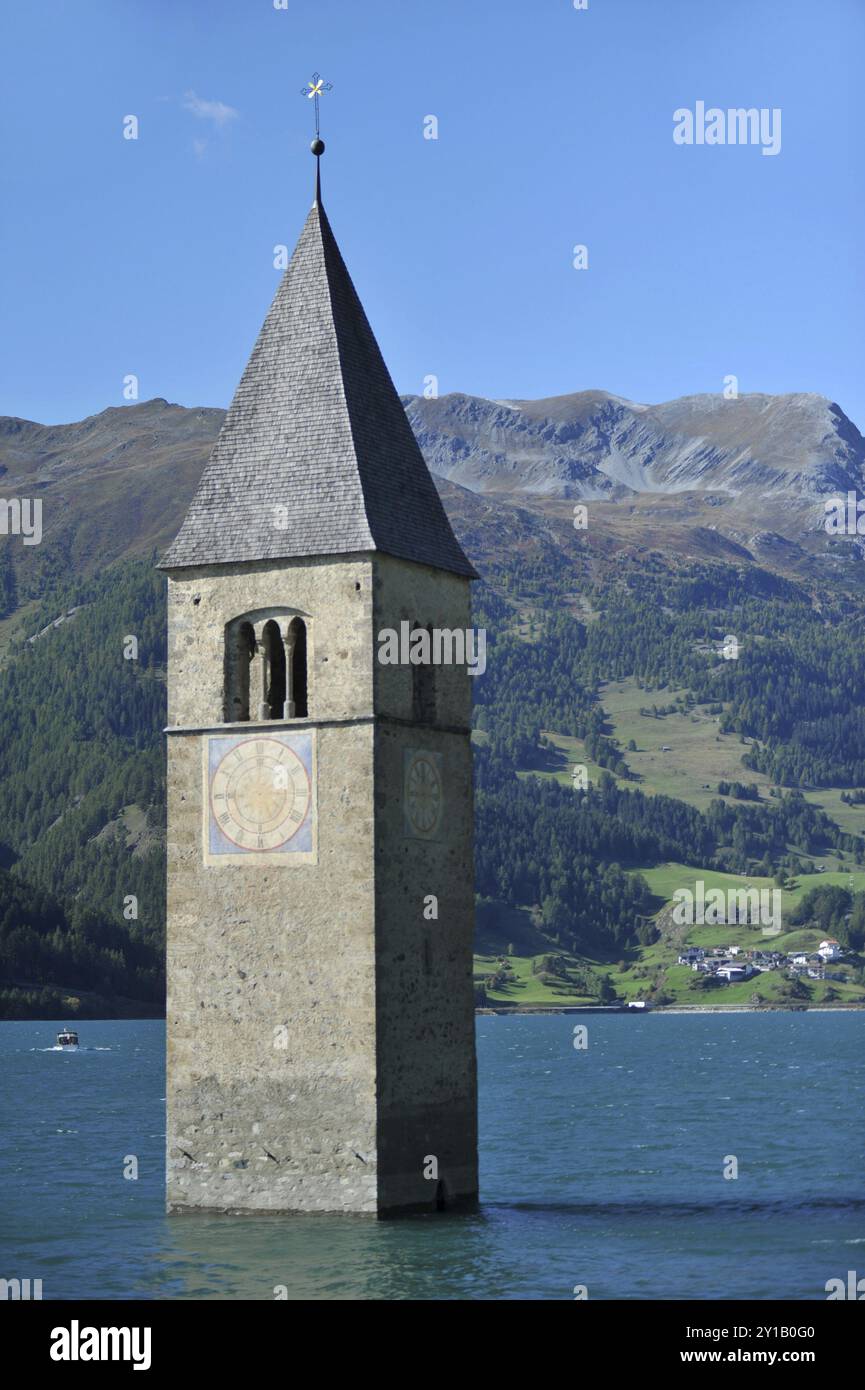 Bell tower of the former parish church of St Catherine in Lake Reschen ...