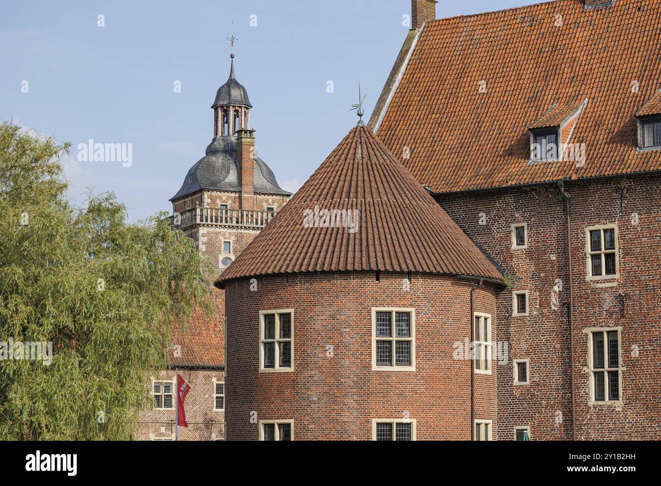 Historic round building with red tiled roof and a tower in the ...
