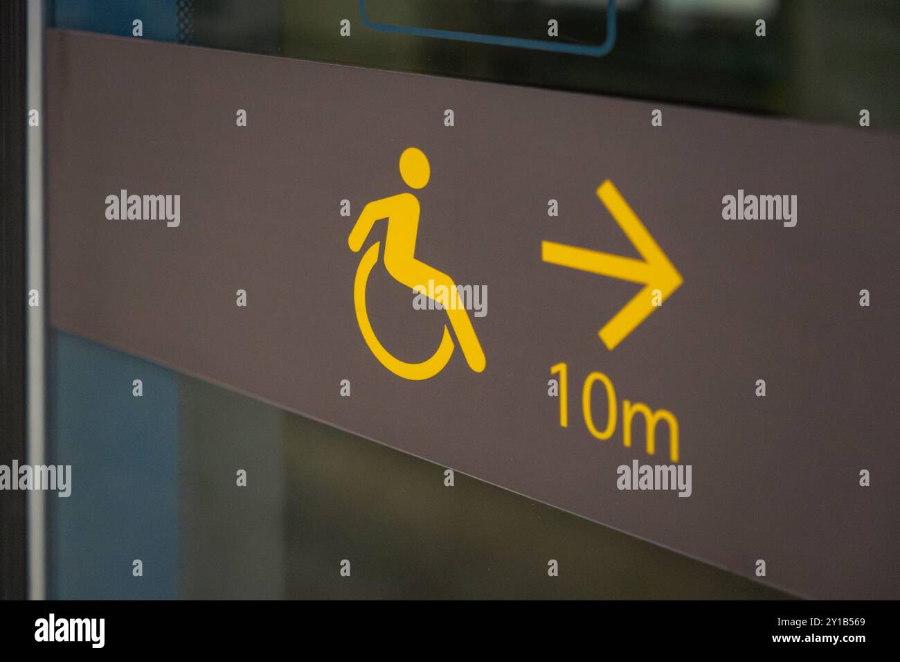 Signs indicating the direction of facilities for the disabled on the ...