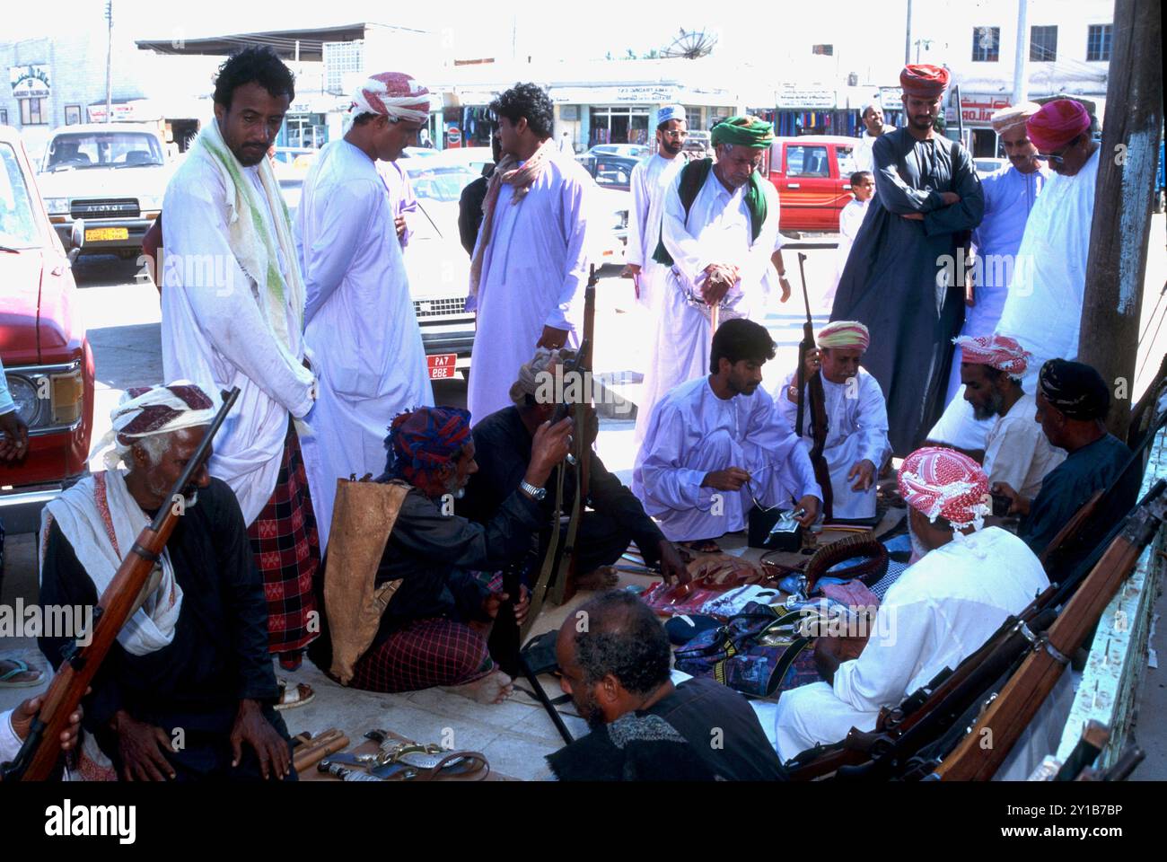 Tribesmen buying arms i the weapons market in Salalah, Dhofar province ...