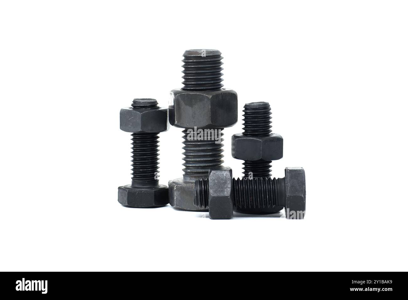 Assorted metal bolts and nuts on a white background. Ideal for ...