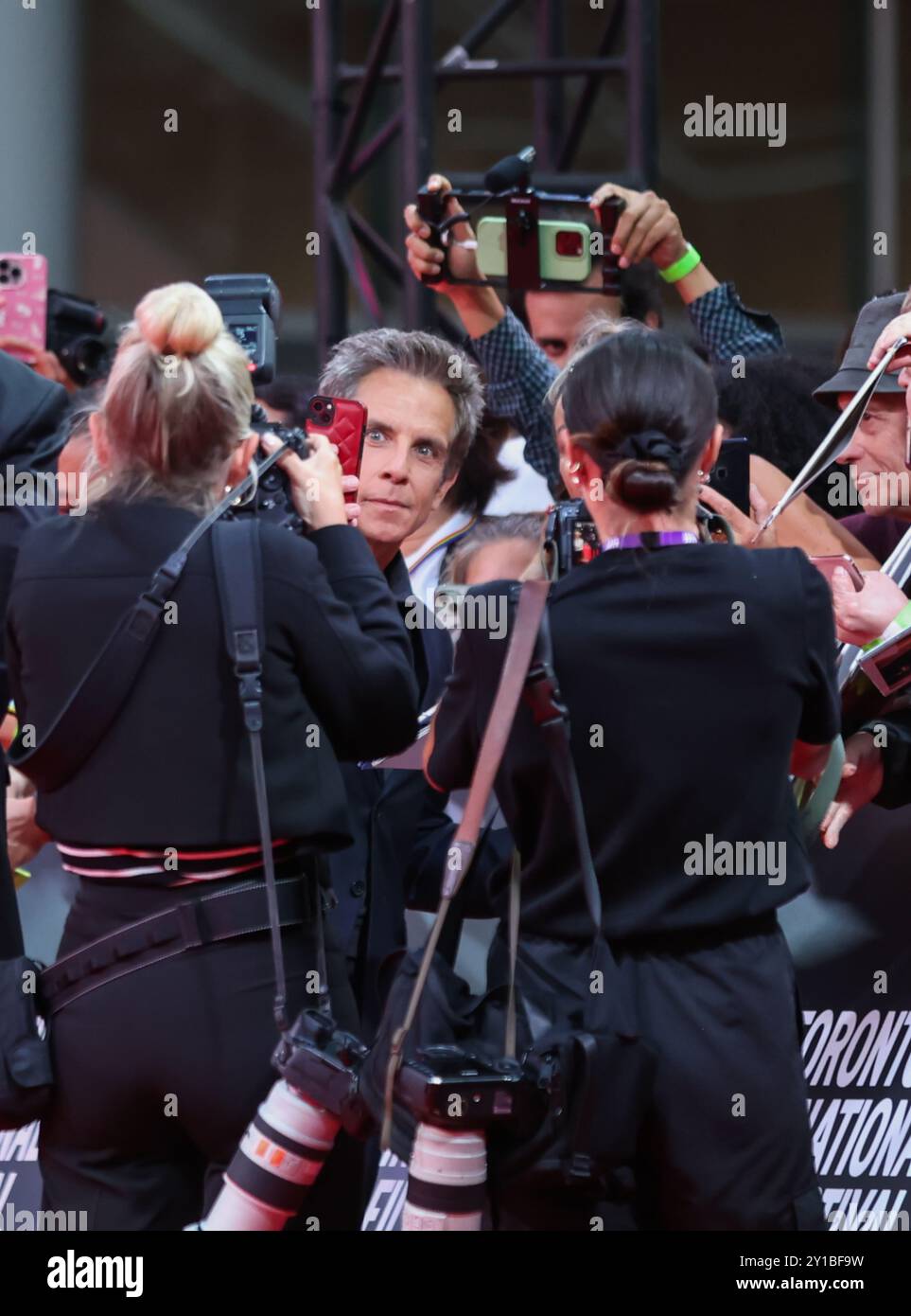 Ben Stiller signs for fans on the red carpet at the Toronto ...