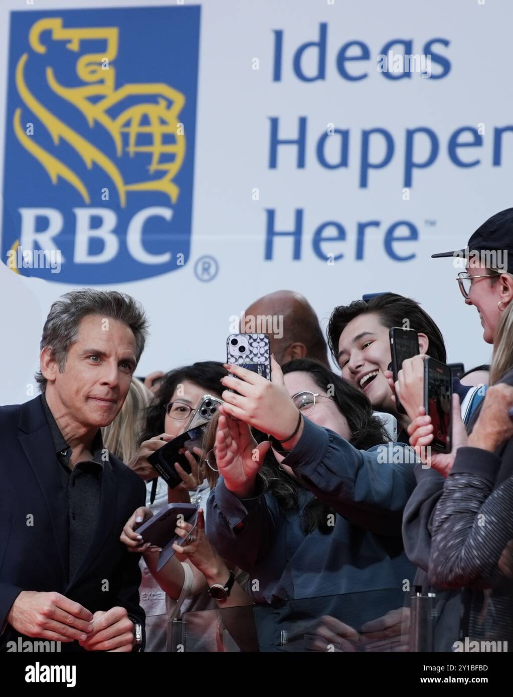 Ben Stiller signs for fans on the red carpet at the Toronto ...