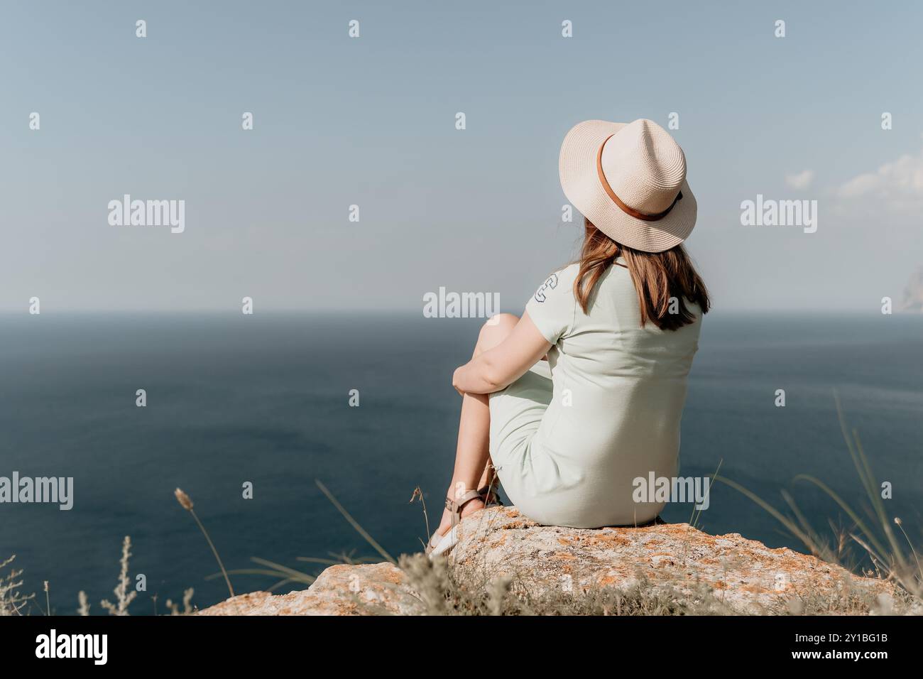 Woman contemplating ocean beach in hi-res stock photography and images - Alamy