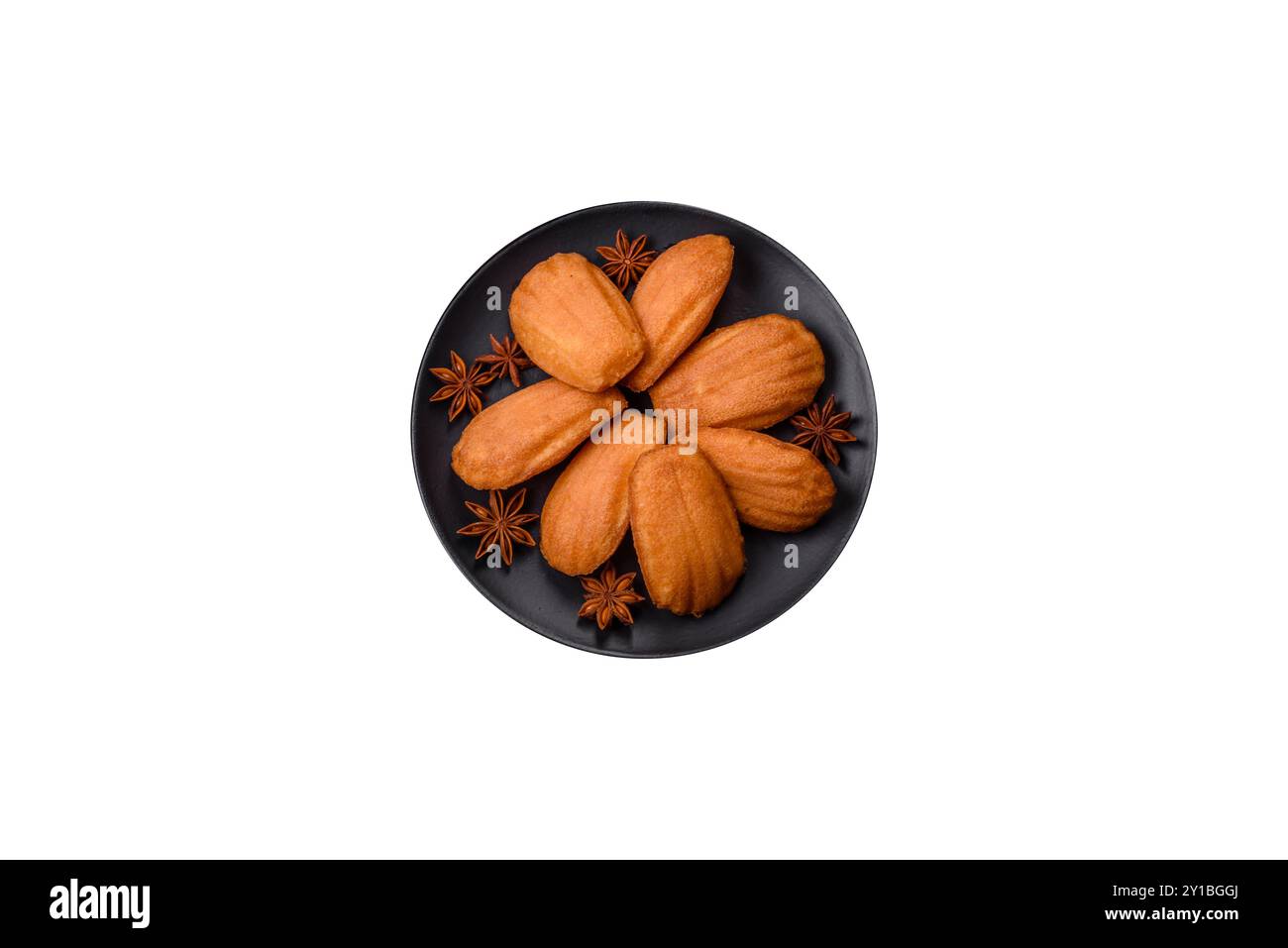 Traditional French madeleine biscuits with nutty flavor on a dark ...