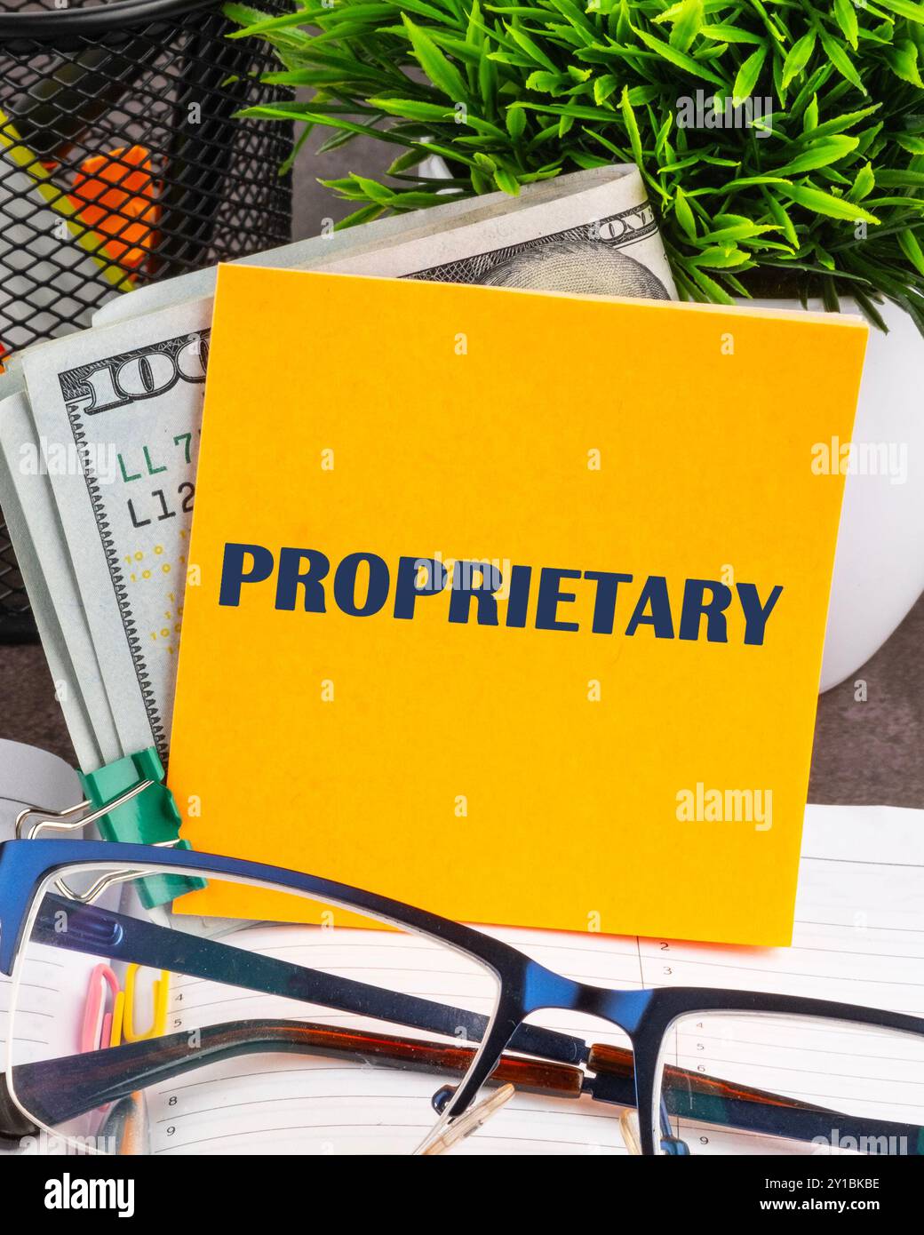 Letters of the alphabet with words PROPRIETARY on a yellow sticker ...