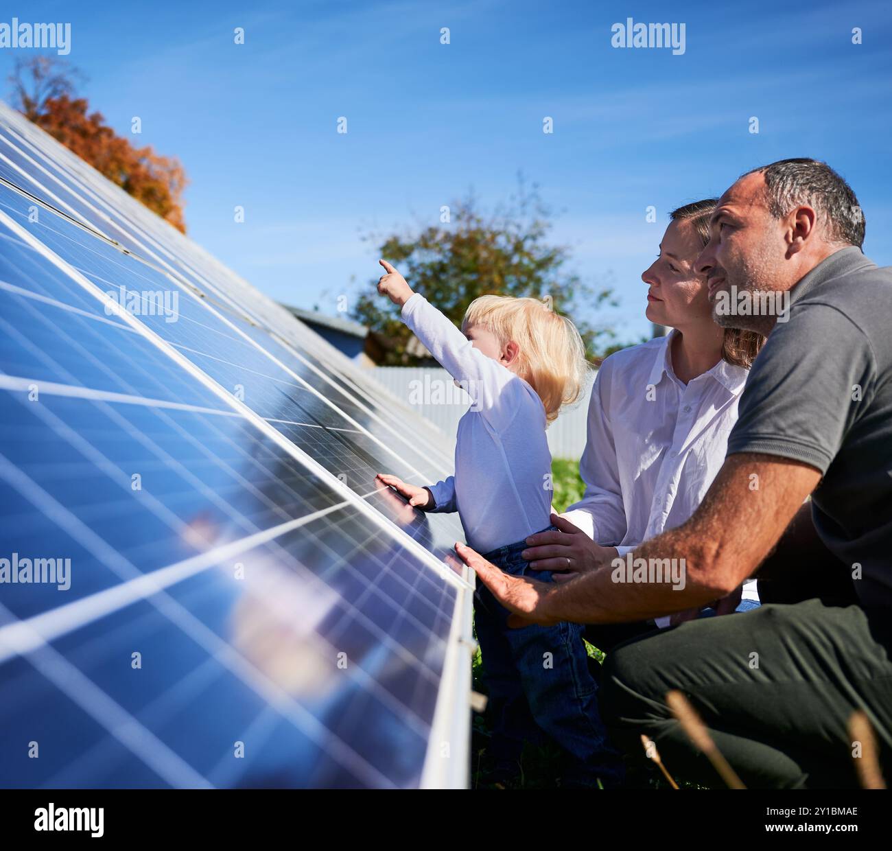 Father showing potential of alternative energy. Contemporary family ...