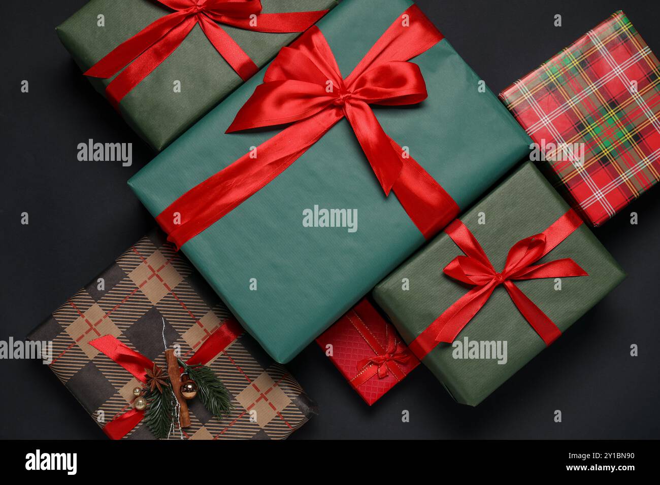 Different gift boxes on black background, flat lay Stock Photo - Alamy