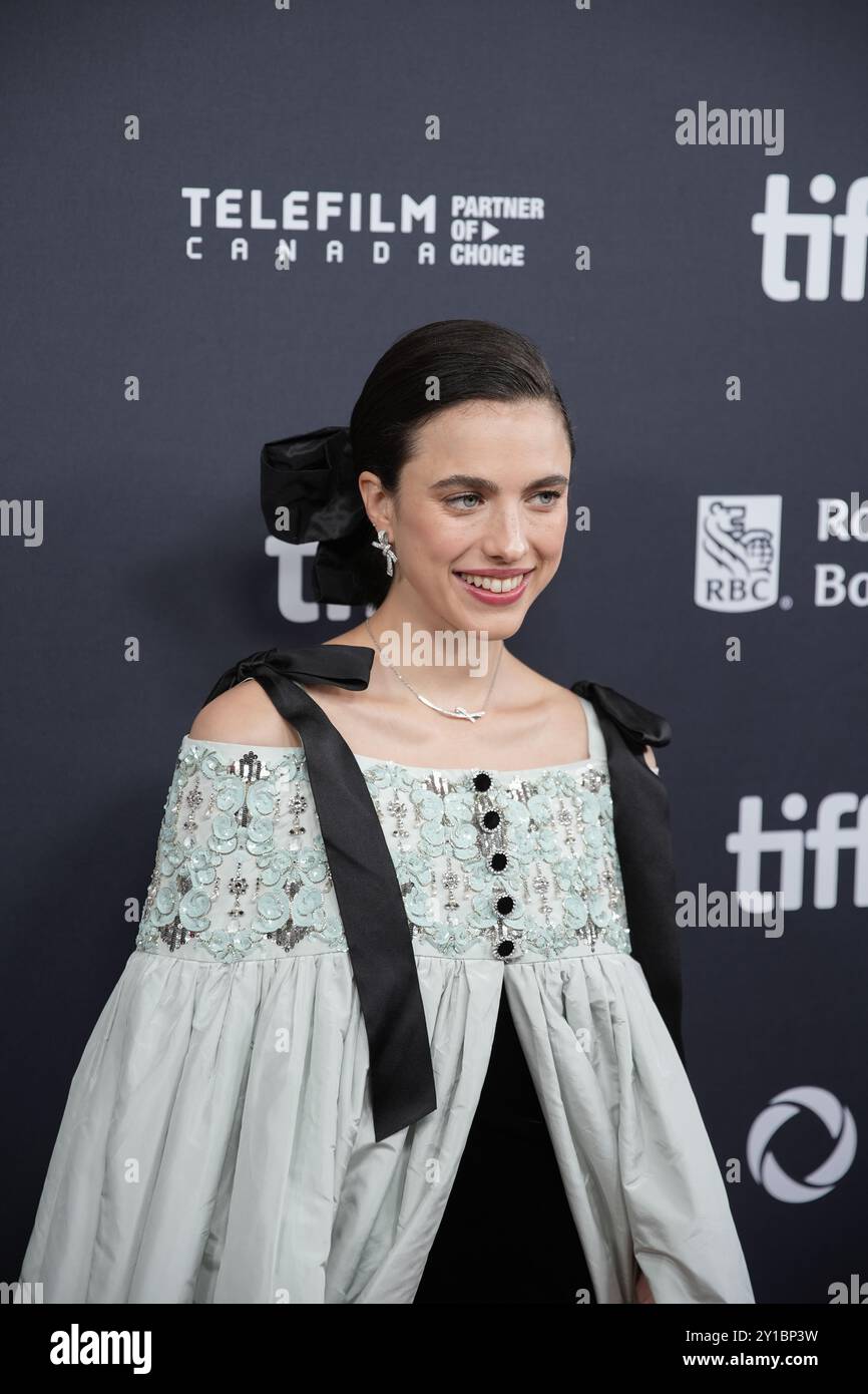 Margaret Qualley poses for cameras on the red carpet at the Toronto ...