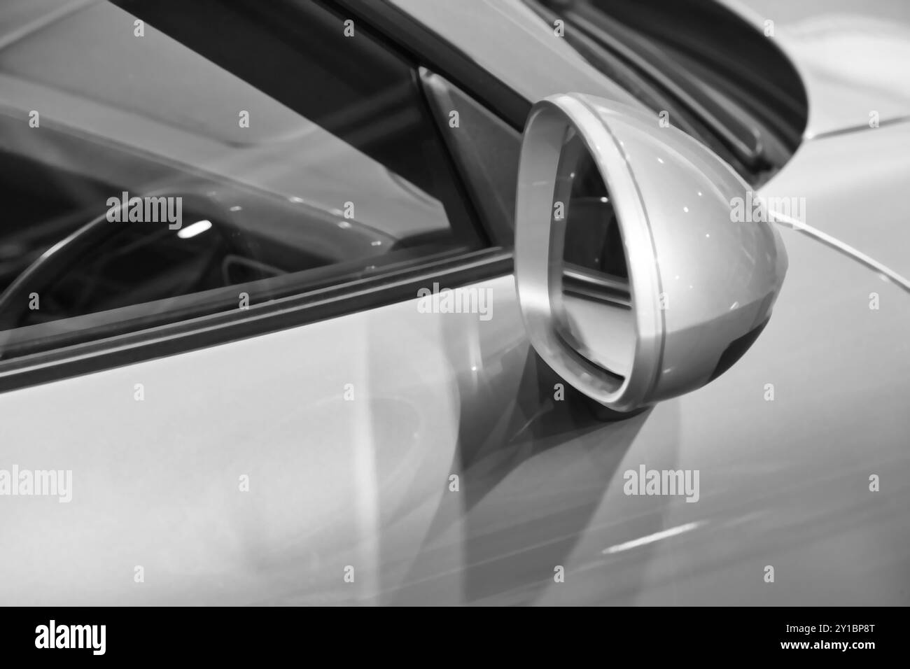 Modern car side mirror detail. Black and white. Automobile Stock Photo ...