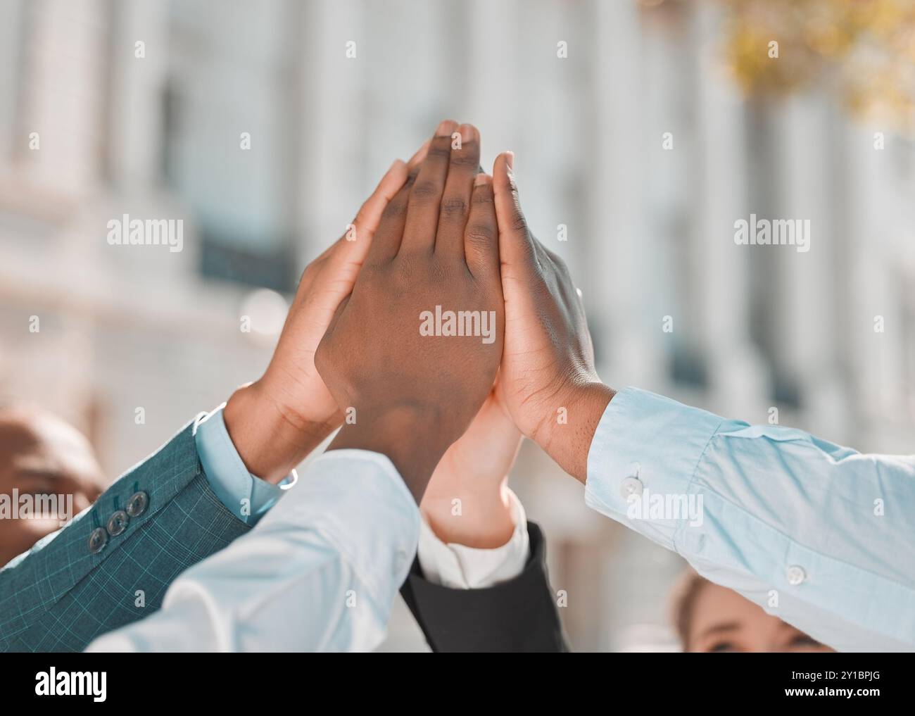 Business, employees and outdoor with high five for support with ...