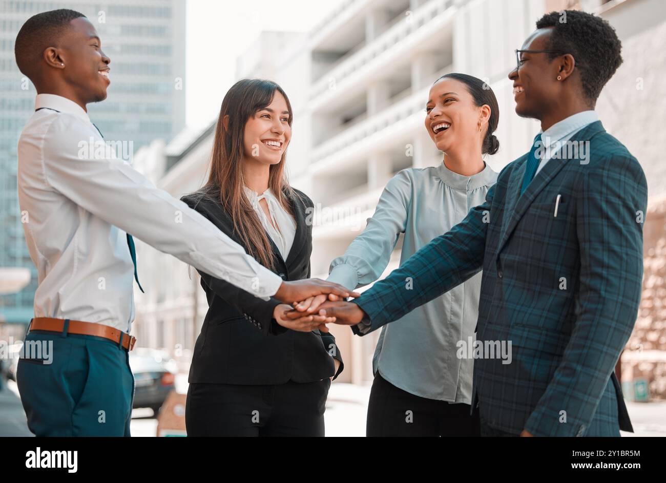 Employees, people and happy with pile of hands for support with ...