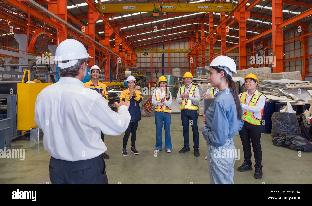 Warehouse safety meeting, people with hard hats. Industrial teamwork ...