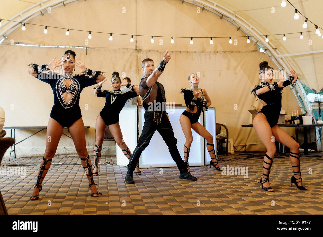 performance of a show-ballet of a dance group of actors in bright ...