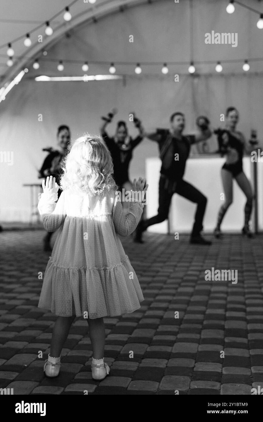 performance of a show-ballet of a dance group of actors in bright ...