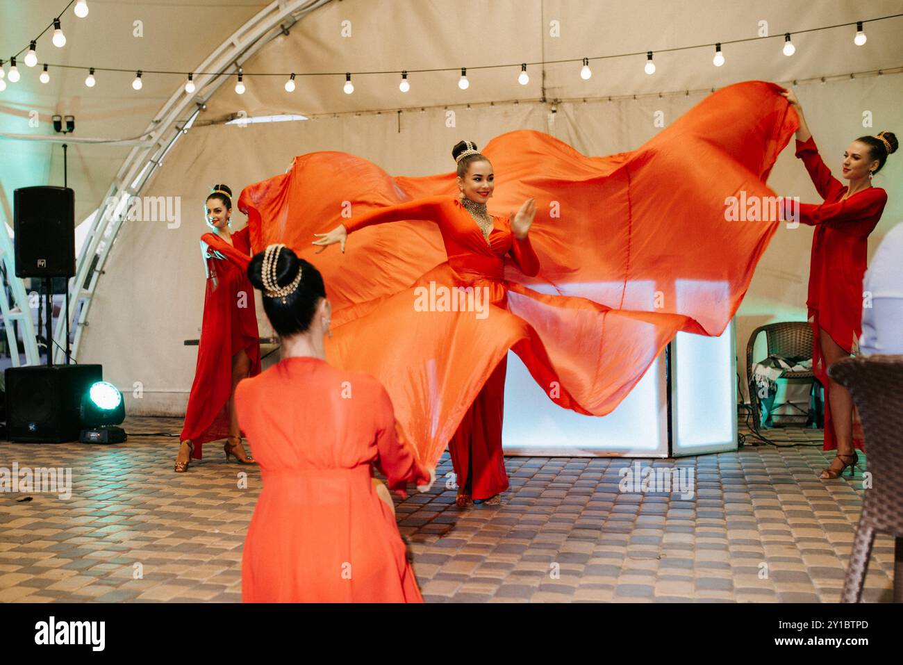 performance of a show-ballet of a dance group of actors in bright ...