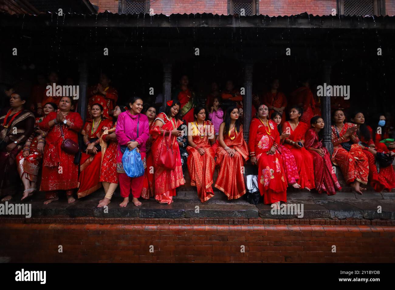 Fasting Nepali Hindu women dressed in red sing in chorus on the ...