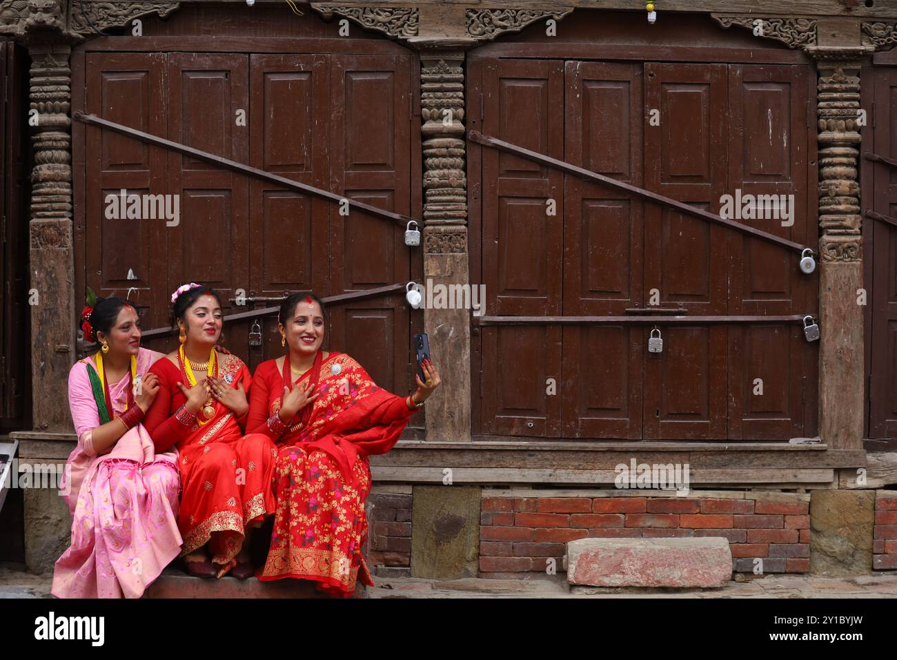 Fasting Nepali Hindu women record a TikTok video in Kathmandu, Nepal ...