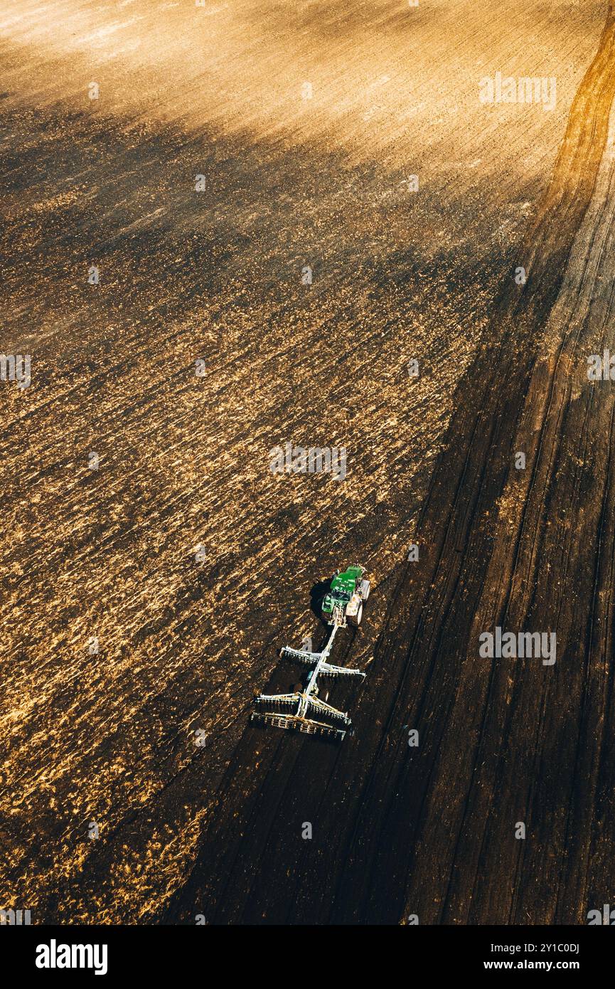 Aerial View. Tractor Plowing Field In Spring Season. Beginning Of ...