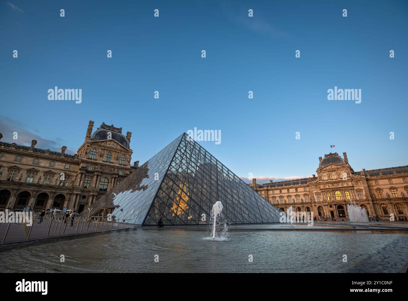The Iconic Louvre Museum and Pyramid at Dusk - Paris, France Stock ...