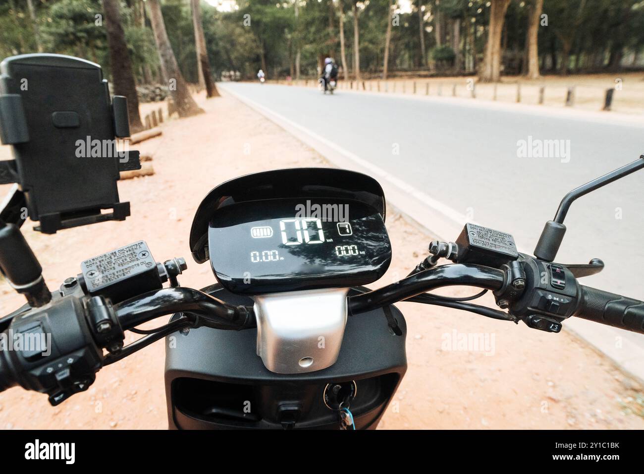 Close up electric motorbike scooter display on with parking sign and ...