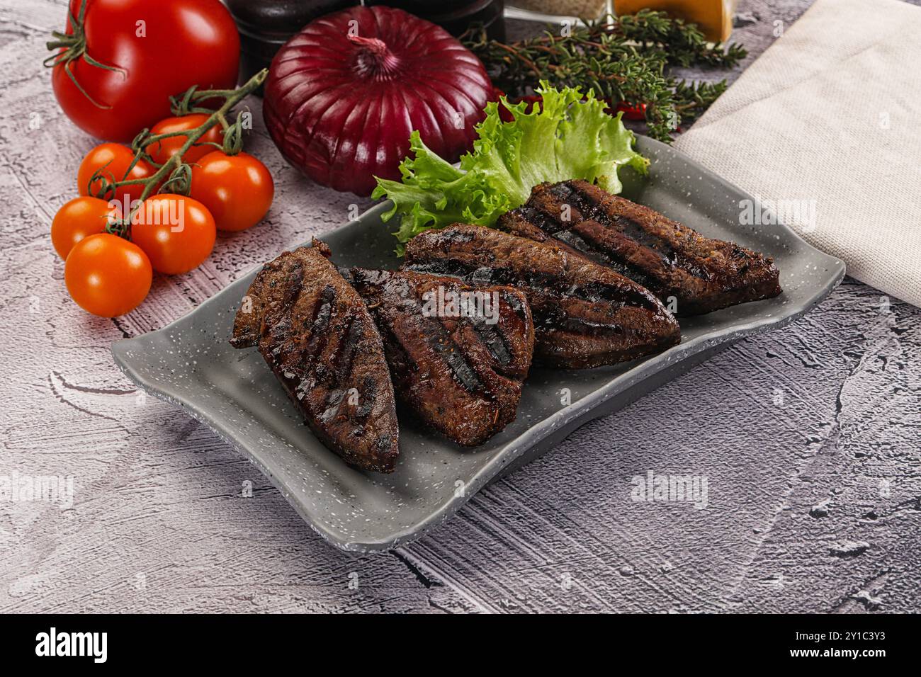 Grilled diet beef liver steak in the plate Stock Photo - Alamy