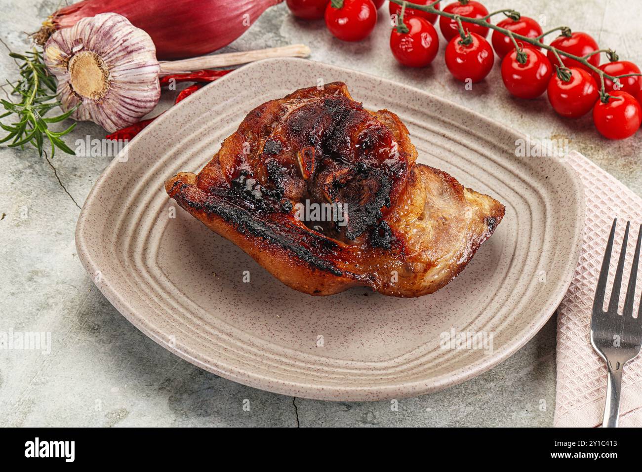 Roasted pork knuckle steak with bone Stock Photo - Alamy