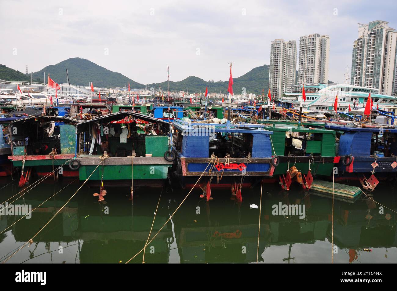 Fishing vessels anchor at a harbor to avoid approaching Typhoon Yagi in ...
