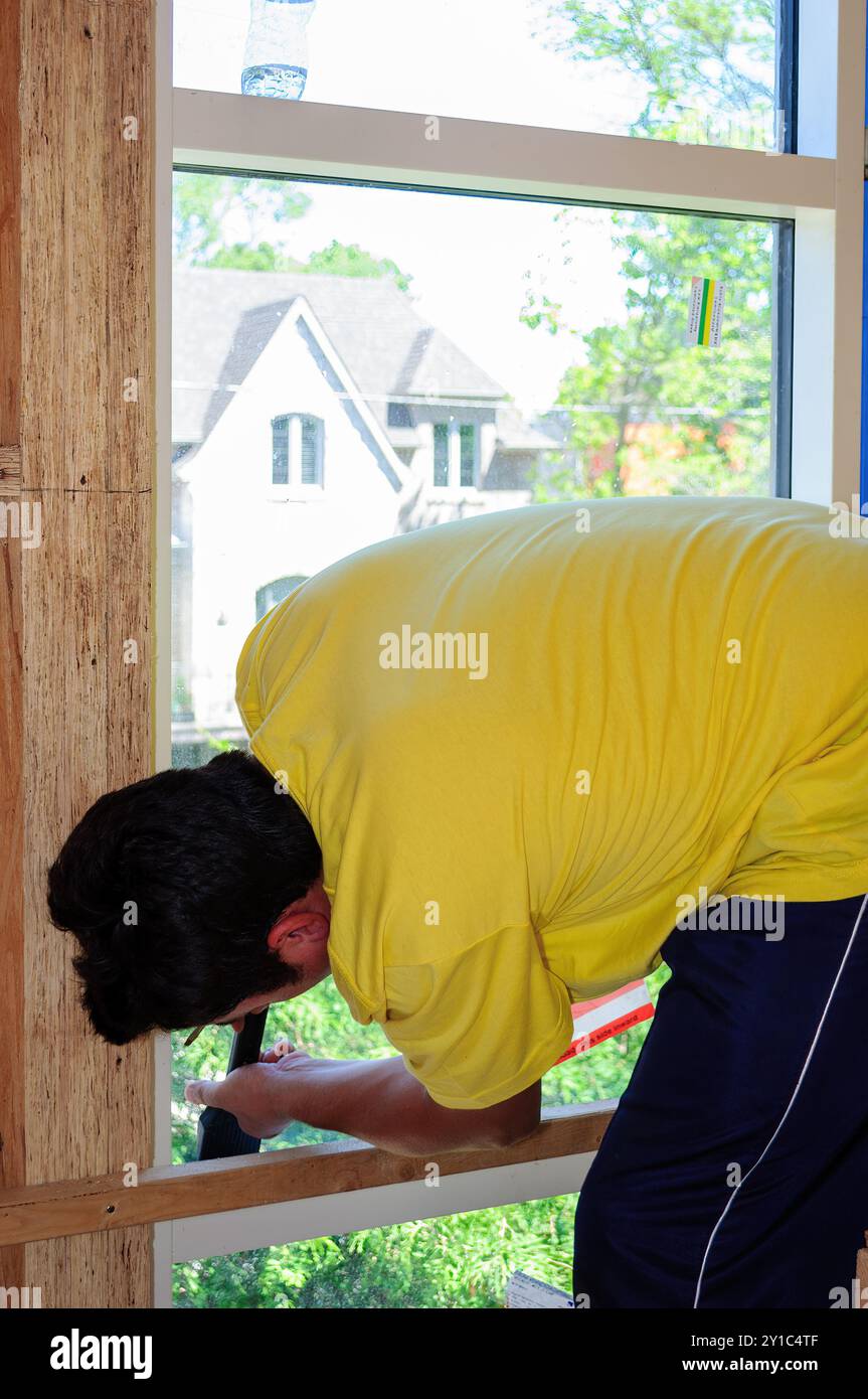 Windows installer man working, Toronto, Canada Stock Photo - Alamy