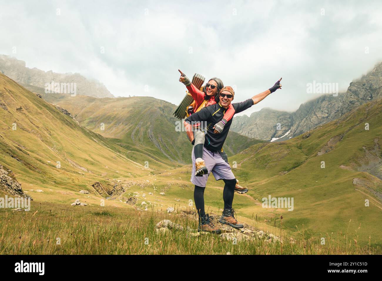 Sporty fit caucasian couple hikers having fun hiking outdoors do ...
