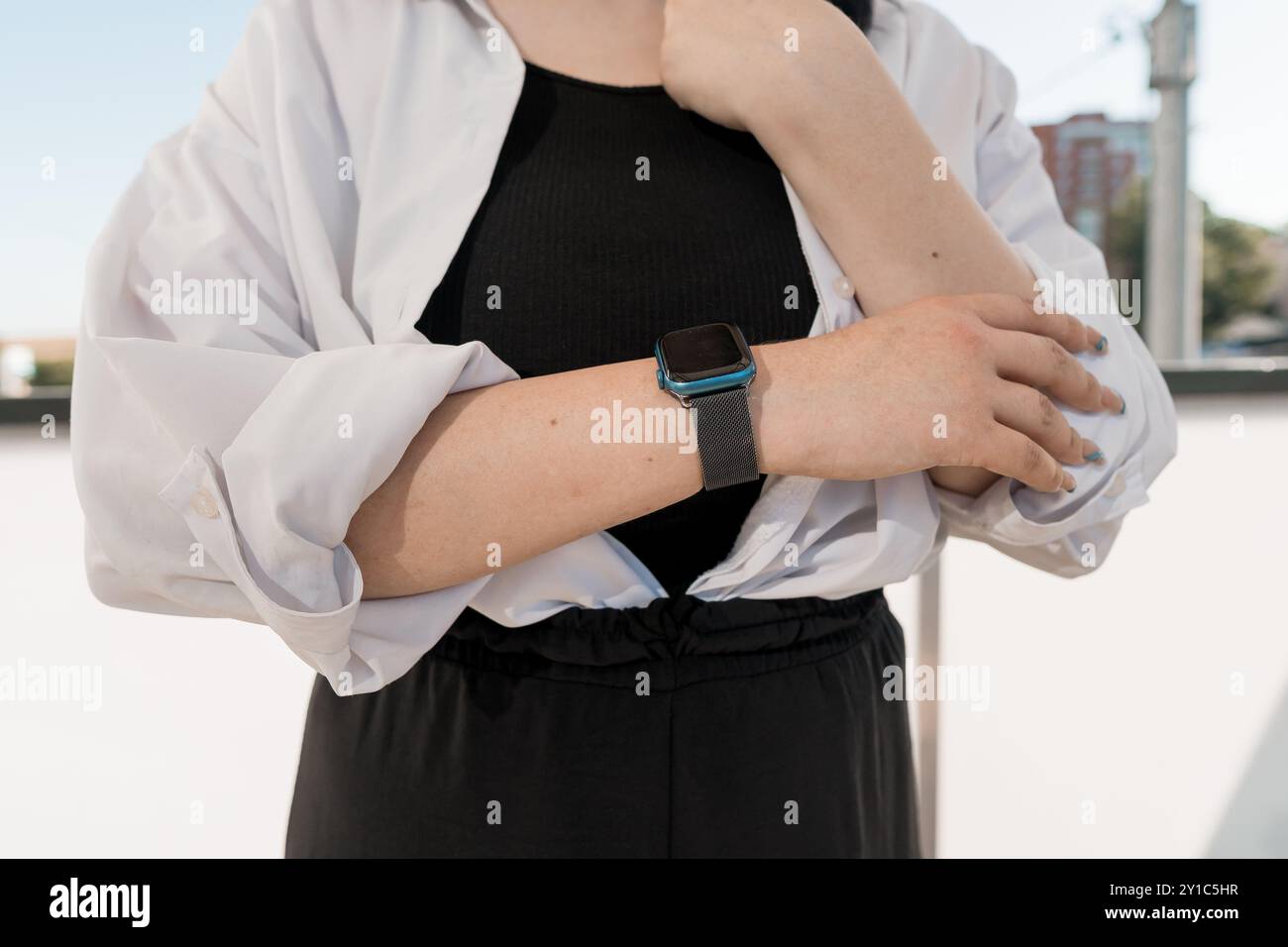 Elegant Urban Fashion: Woman Wearing Smartwatch and Stylish Attire ...