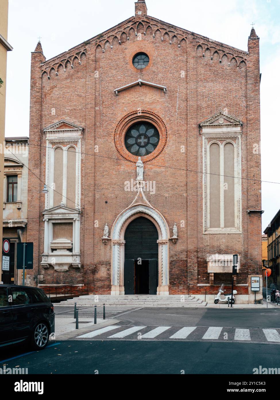This historic brick church features an intricate facade and a prominent ...