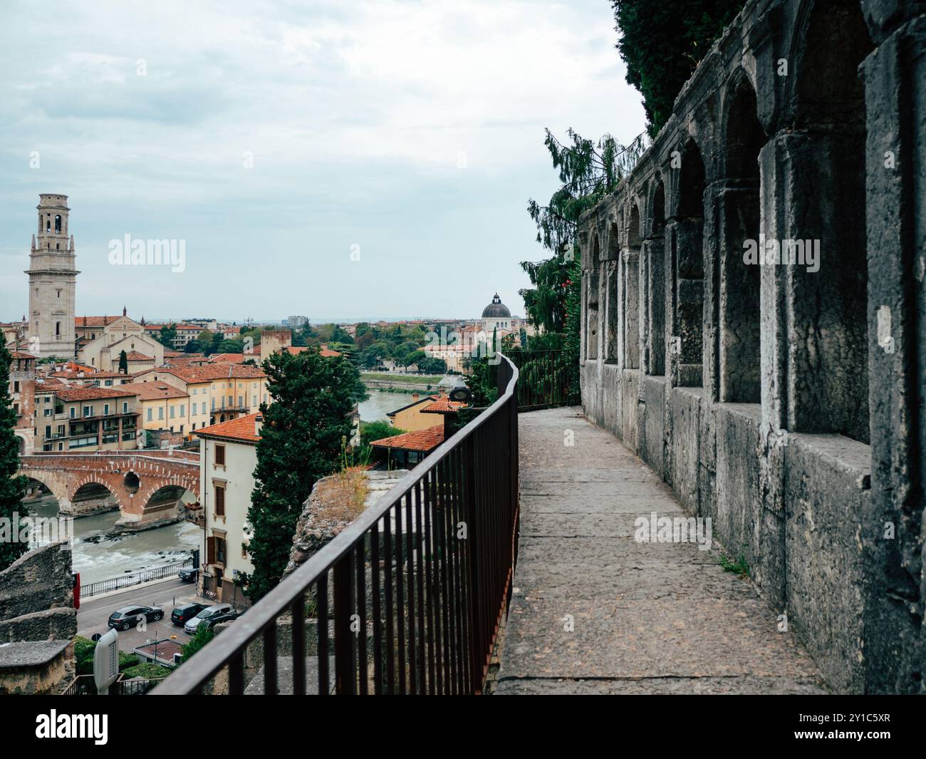 Strolling along a cobblestone pathway overlooking the river, this view ...
