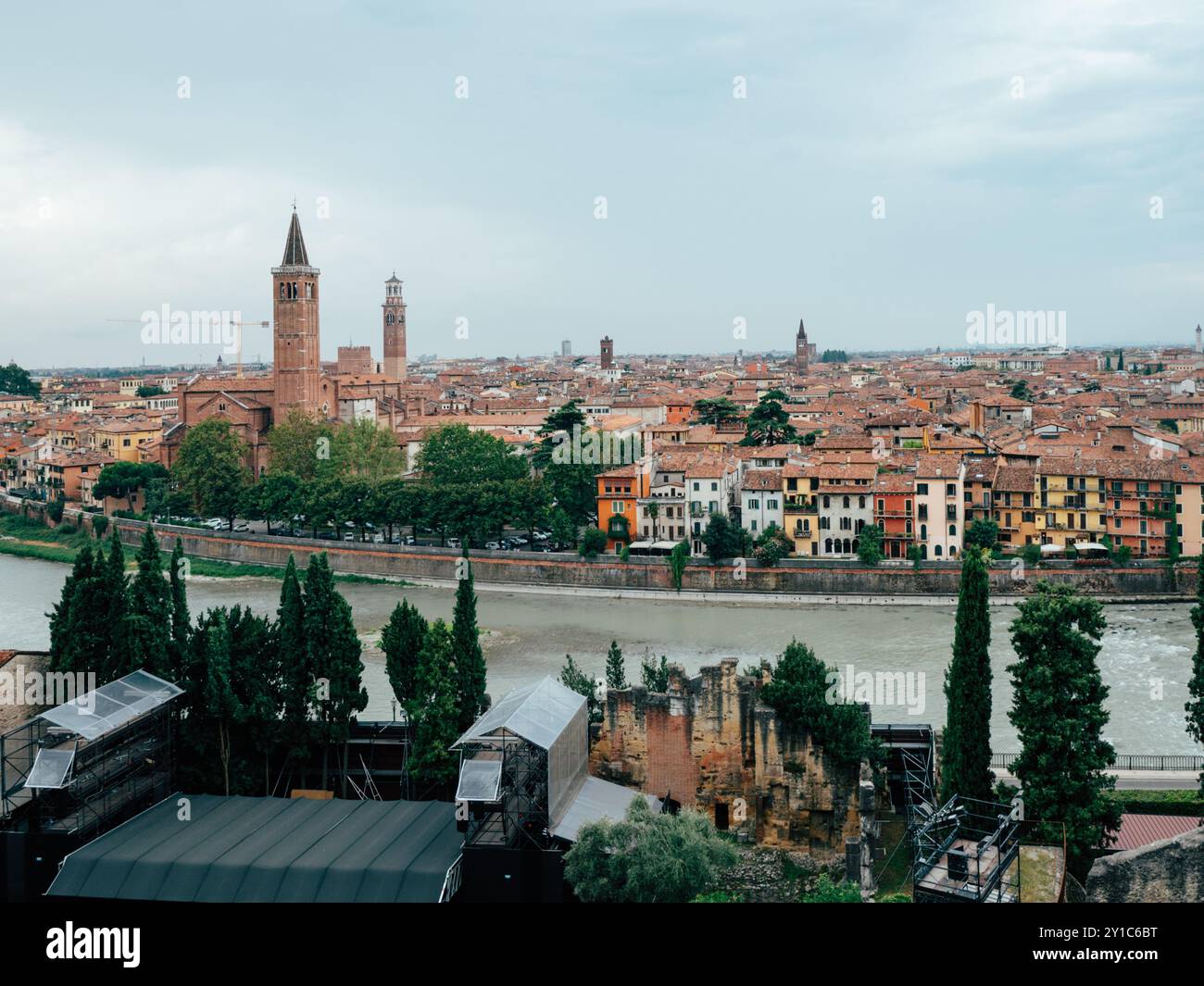 A panoramic view captures Verona's iconic riverside architecture, with ...