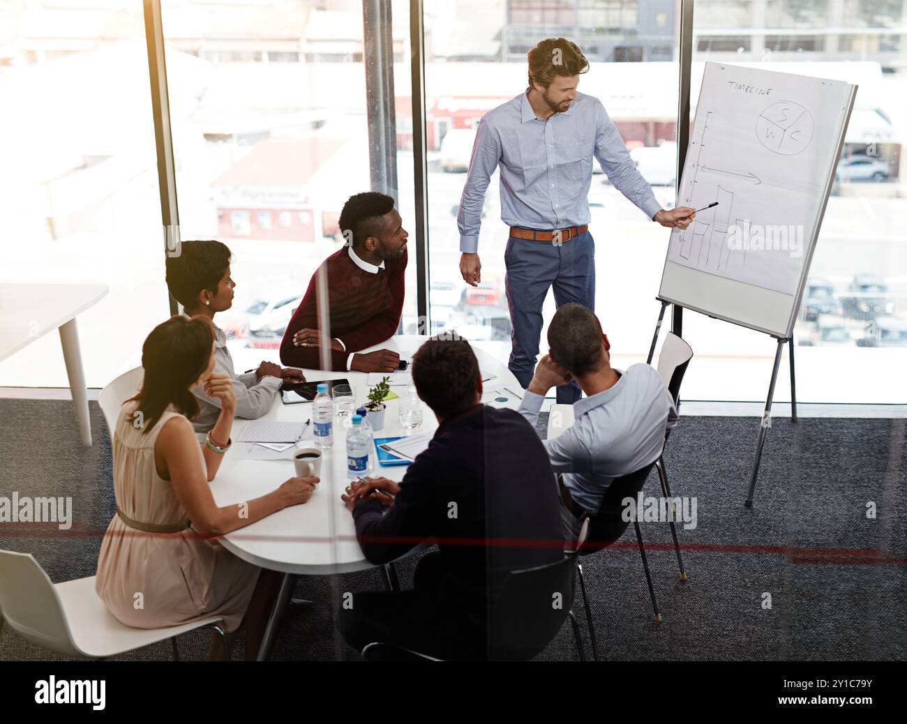 Pointing, presentation and man with whiteboard, office and discussion ...